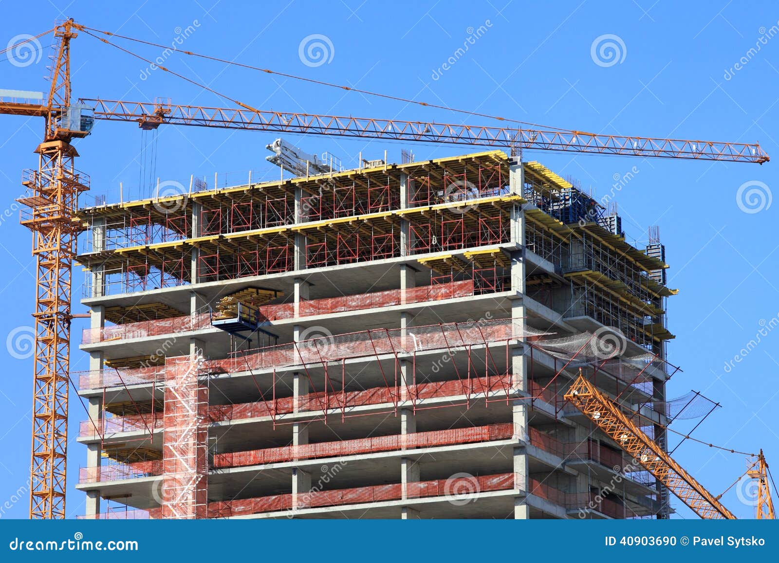 Crane and High-rise Building Under Construction Against Blue Sky. Stock ...