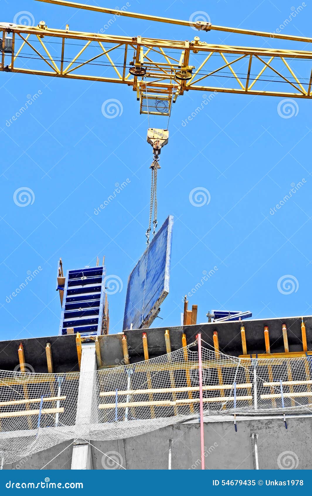 Crane hoisting formwork stock image. Image of housing - 54679435