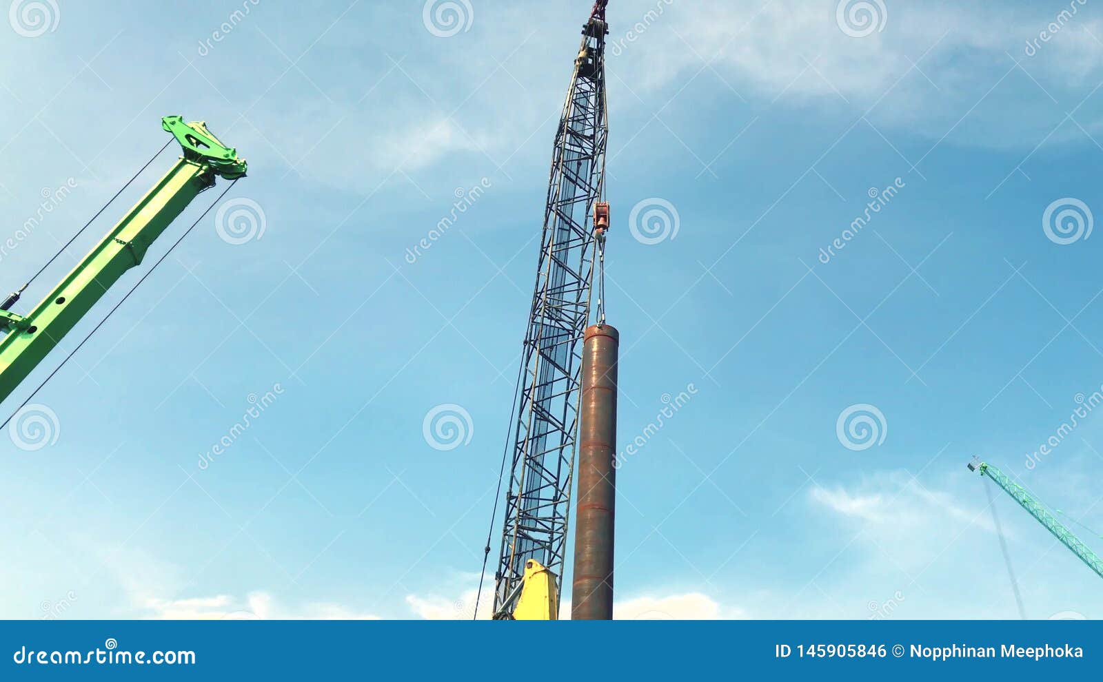 Crane is Lifting the Casting Pipe To Press Down on the Ground Stock ...