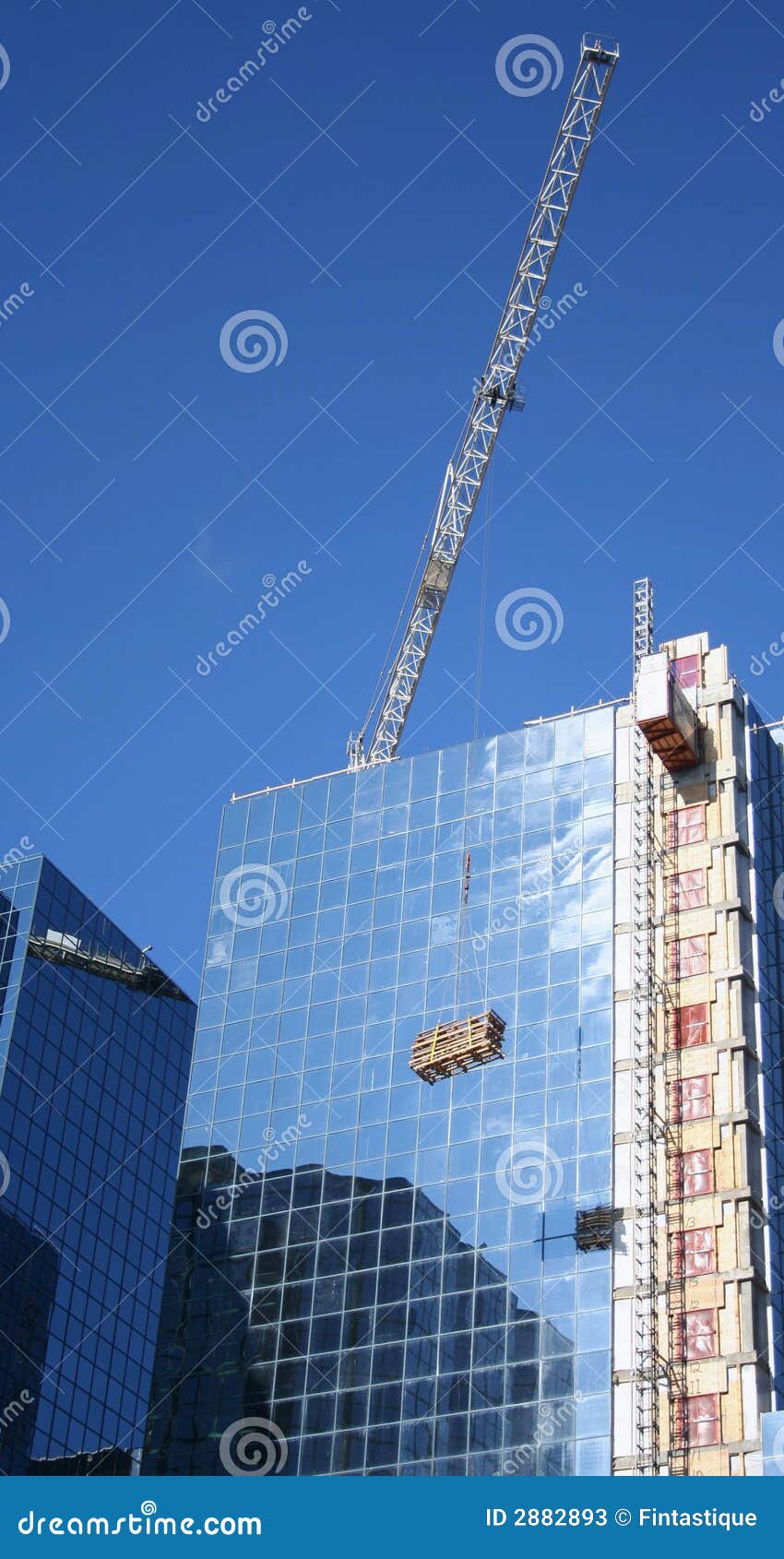 Crane lifting load stock image. Image of lifting, tall - 2882893