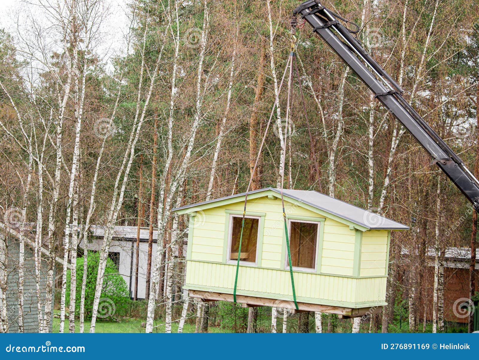 Crane Lifting Up the Tiny House Outdoors in Spring. Stock Image - Image ...