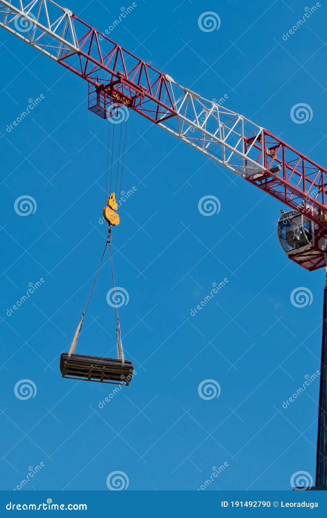 The Crane Lifts a Heavy Load on a Hook. Stock Photo - Image of lifts ...