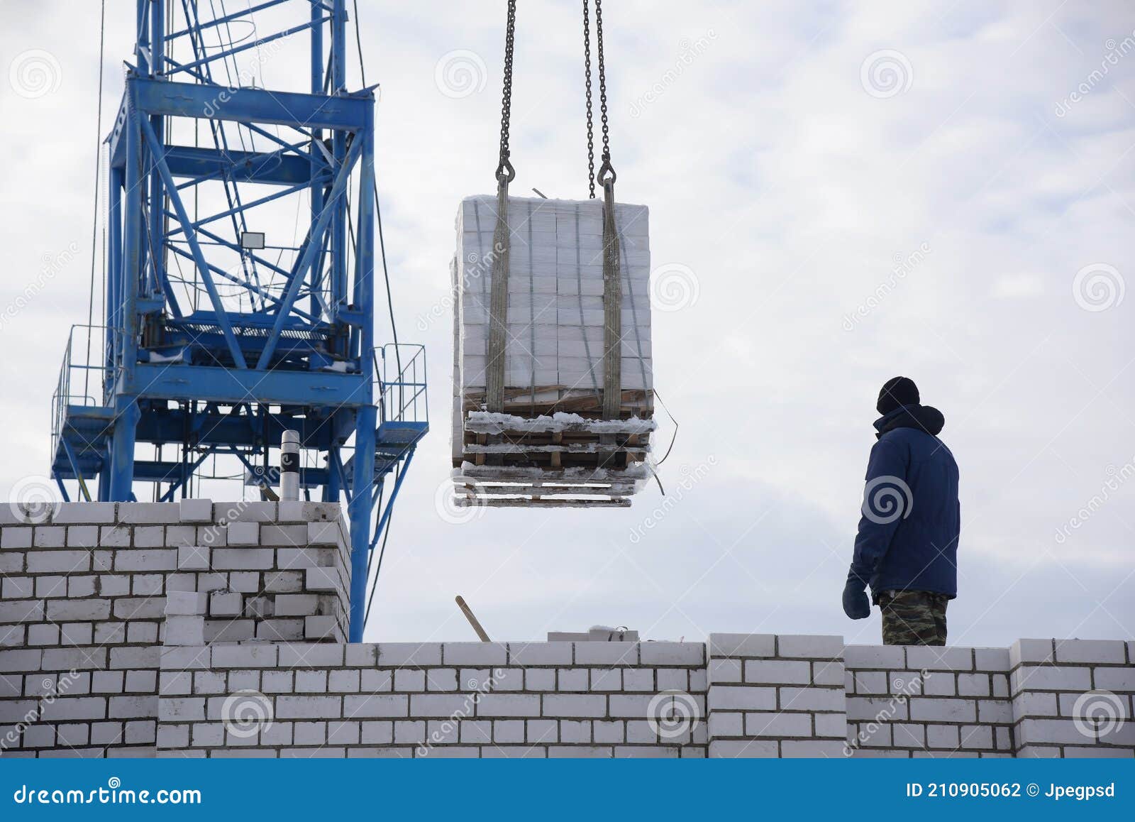 A Crane Lifts the Pallet with Bricks. Stock Photo - Image of ...