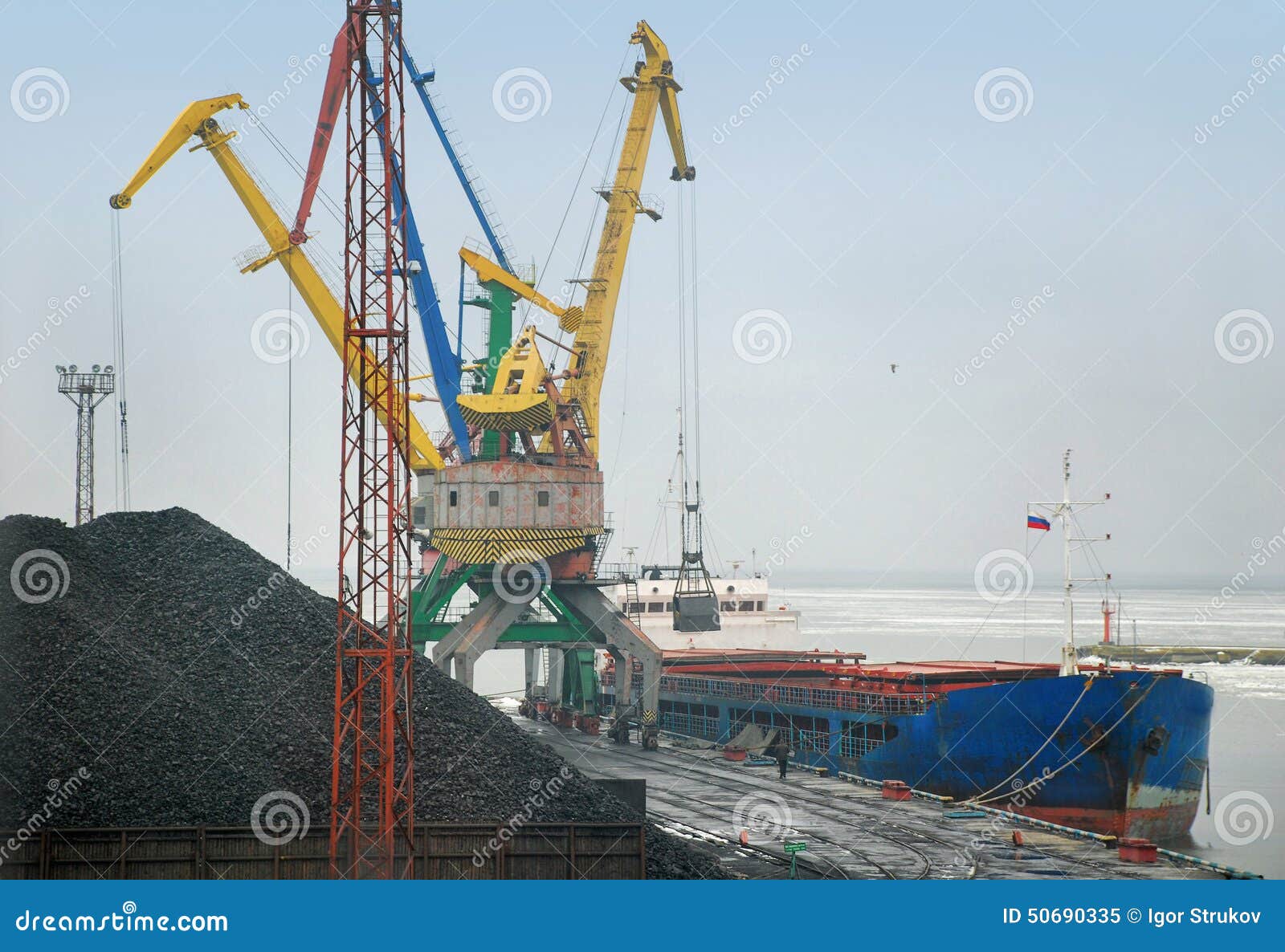 Loading Coal From Cargo Barges Onto A Bulk Carrier Using Ship Cranes ...