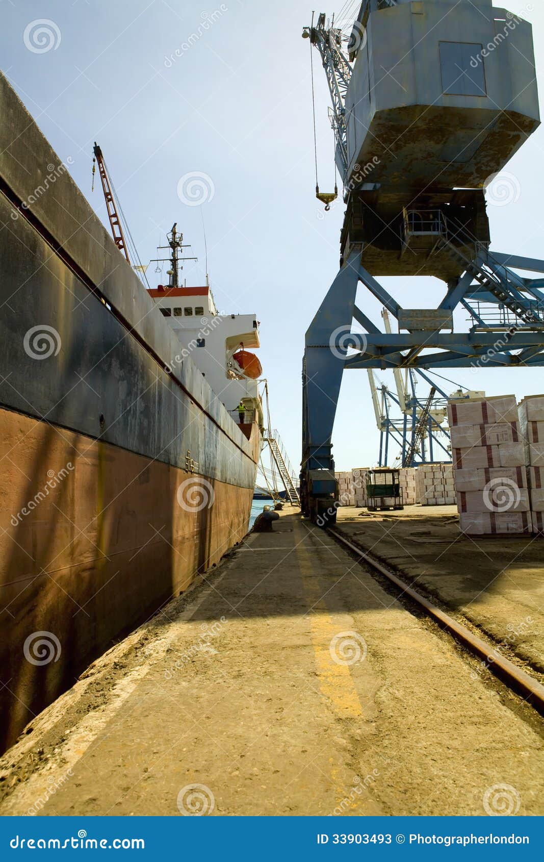 Crane Loading Freighter with Cargo Stock Image - Image of ship, heavy ...