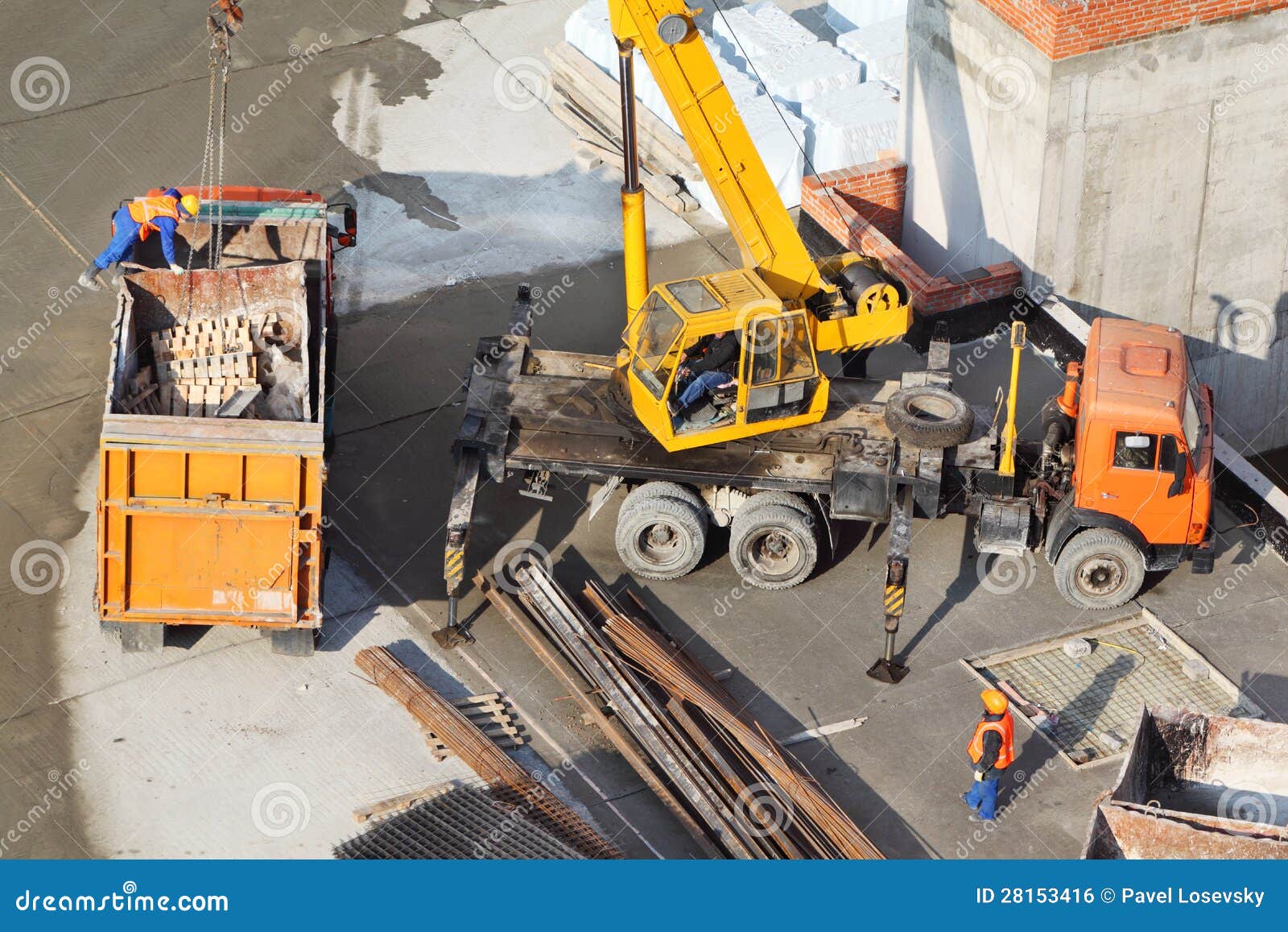 Crane Loads Garbage into Truck at Construction Site Stock Photo - Image ...