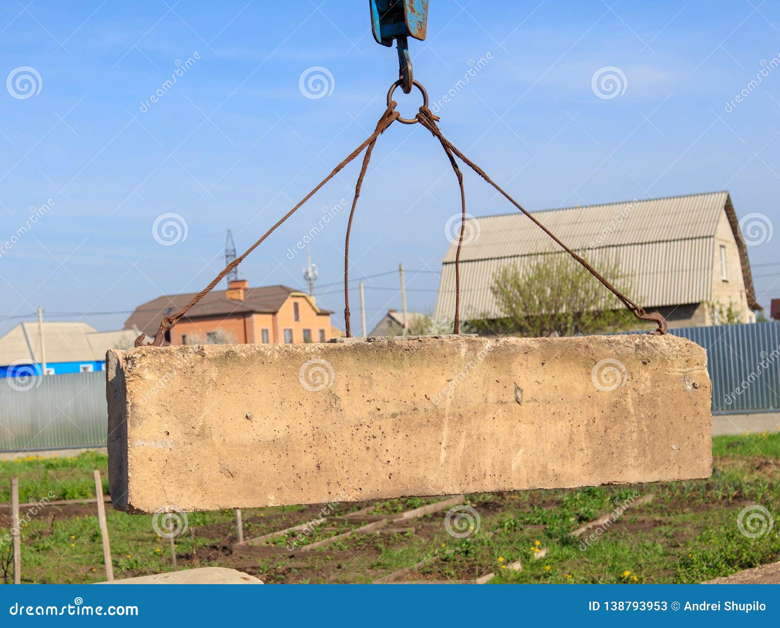 The Crane Loads Old Concrete Blocks at the Construction Site Stock ...