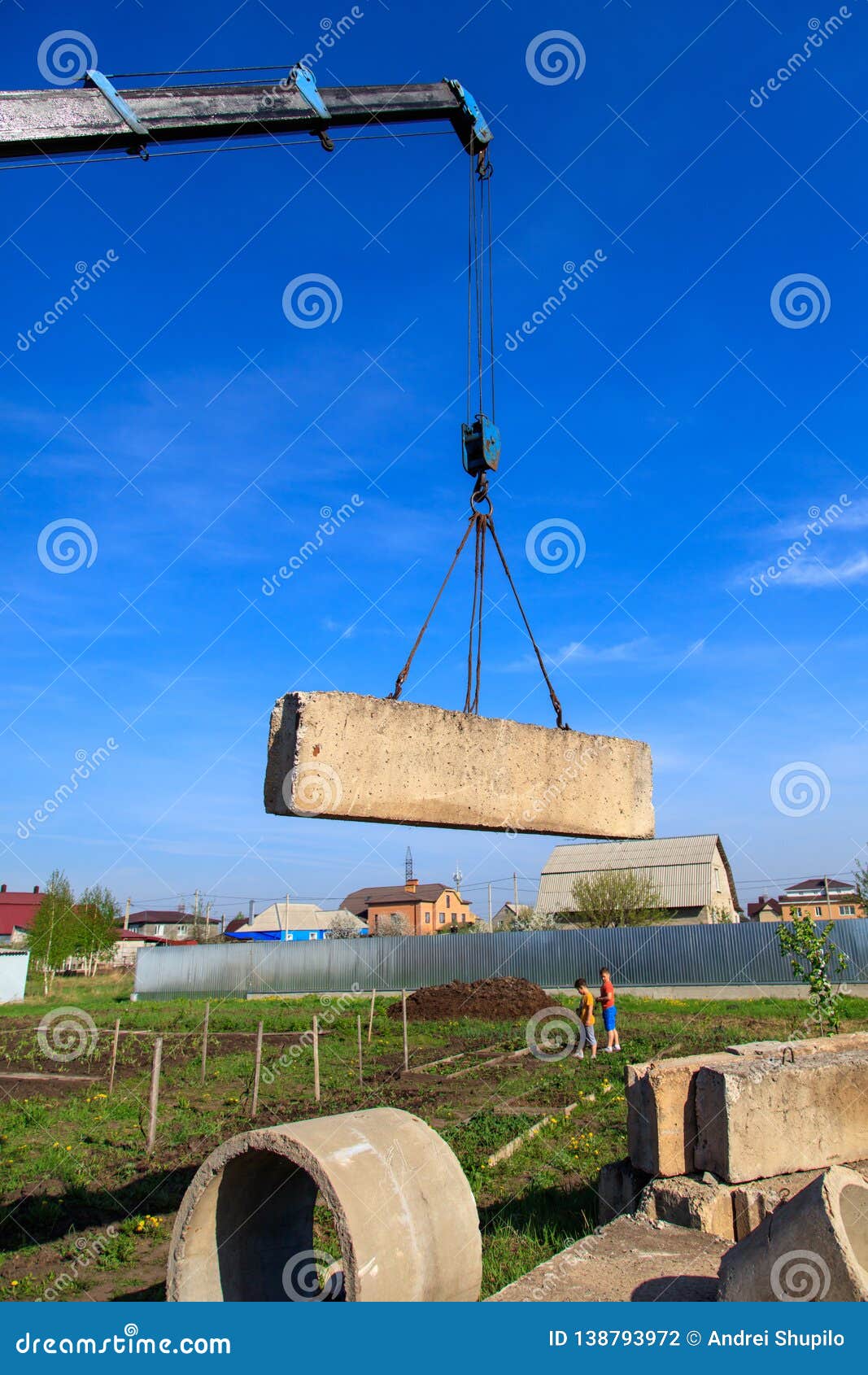 The Crane Loads Old Concrete Blocks at the Construction Site Stock ...