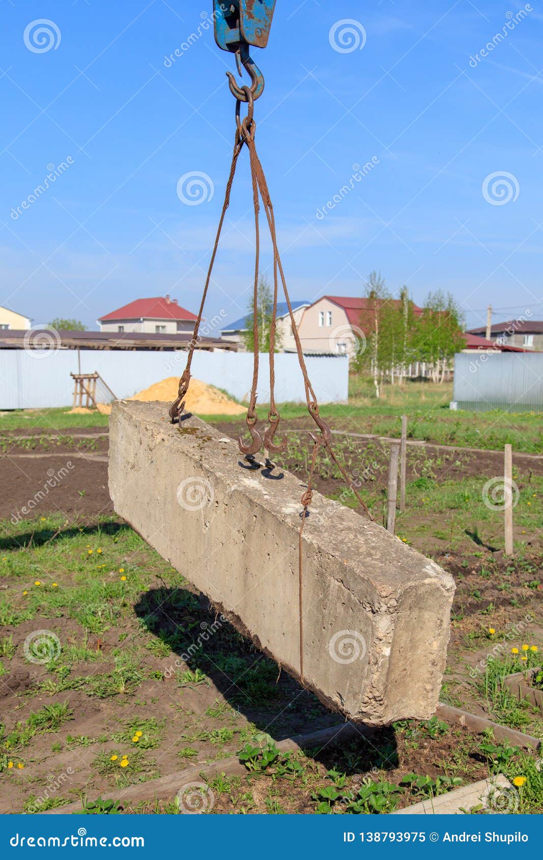 The Crane Loads Old Concrete Blocks at the Construction Site Stock ...