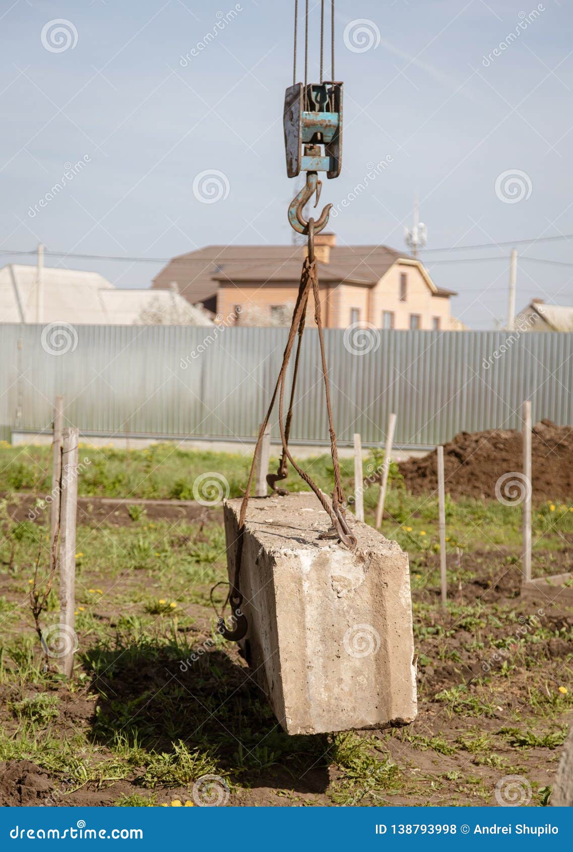The Crane Loads Old Concrete Blocks at the Construction Site Stock ...