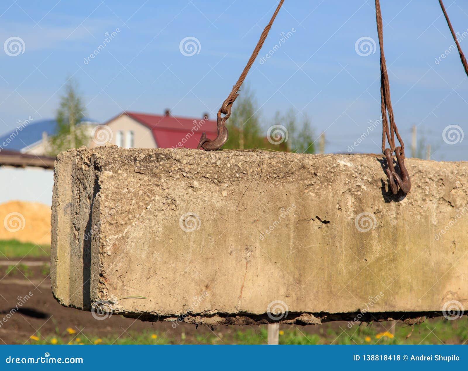 The Crane Loads Old Concrete Blocks at the Construction Site Stock ...