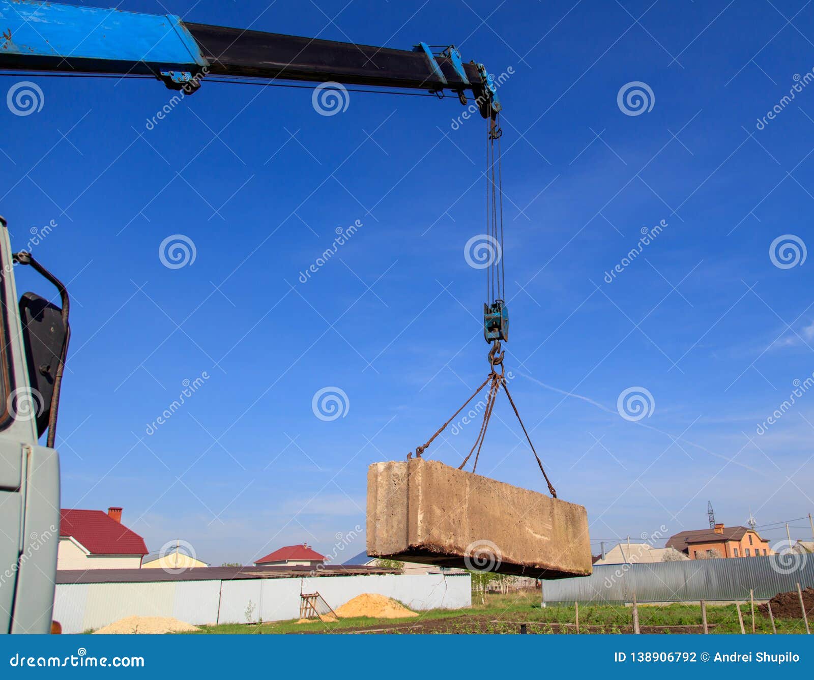 The Crane Loads Old Concrete Blocks at the Construction Site Stock ...