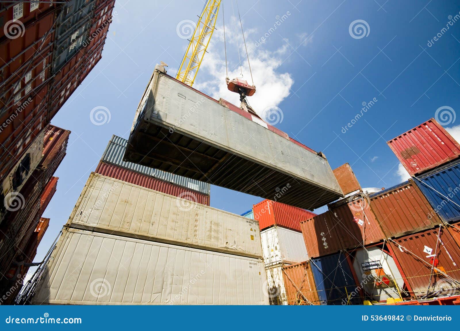 Crane Lowering Container To Stack of Containers. Stock Photo - Image of ...