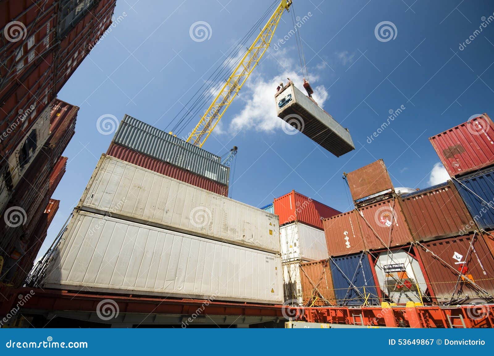Crane Lowering Container To Stack of Containers. Stock Image - Image of ...