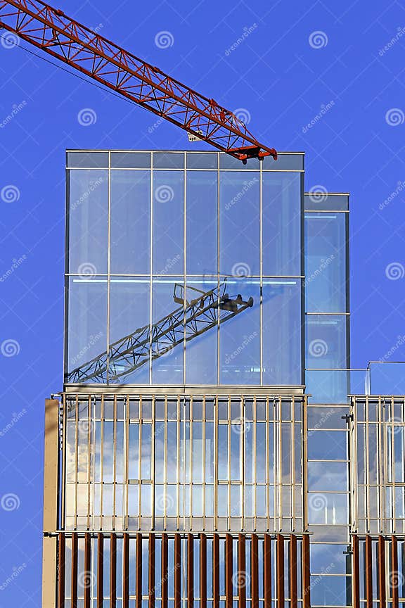 Crane with Mirror Glass Skyscraper Stock Image - Image of cranes ...