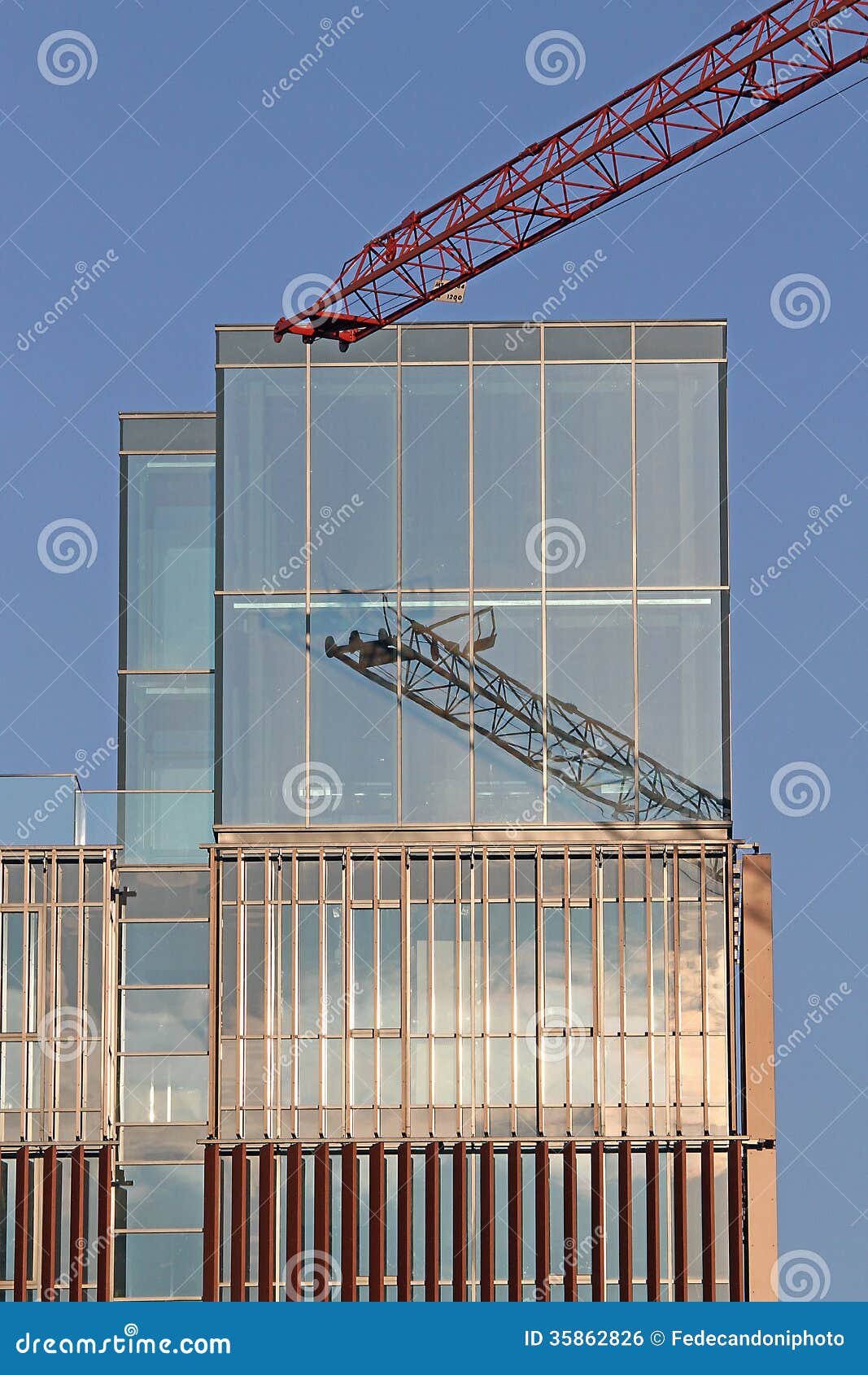 Crane with Mirror Glass Skyscraper Under Construction Stock Photo ...