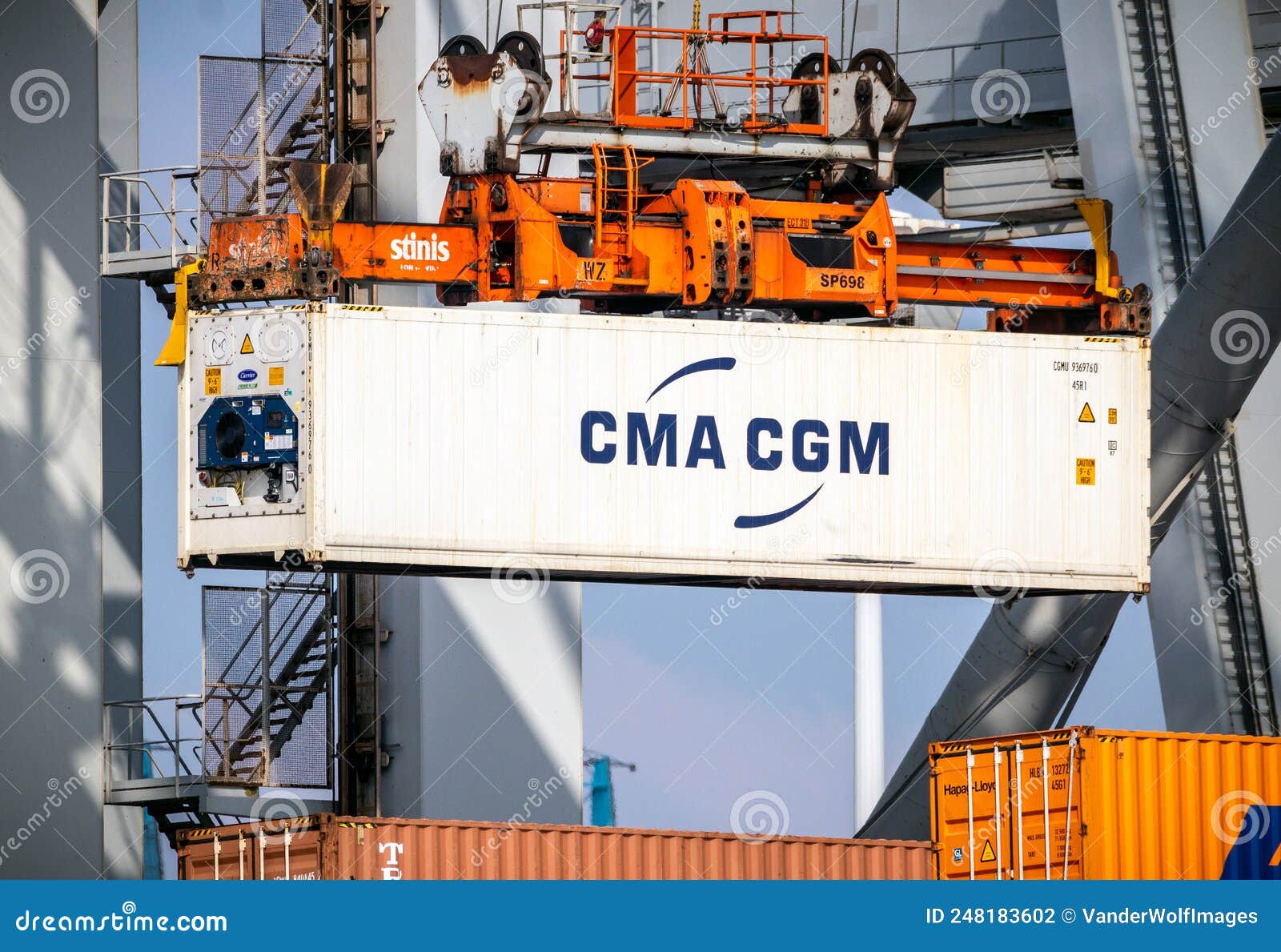 Crane Operator Unloading a Refrigerated Container from a Cargo Ship the ...