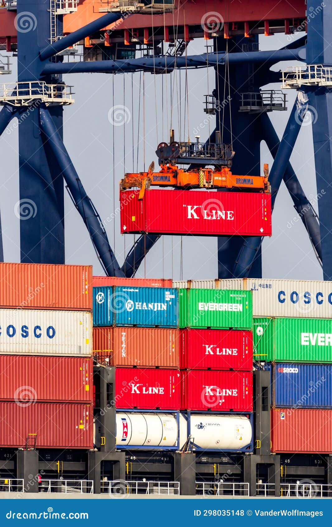 Crane Operator Unloading a Sea Container from a Cargo Ship in the Port ...