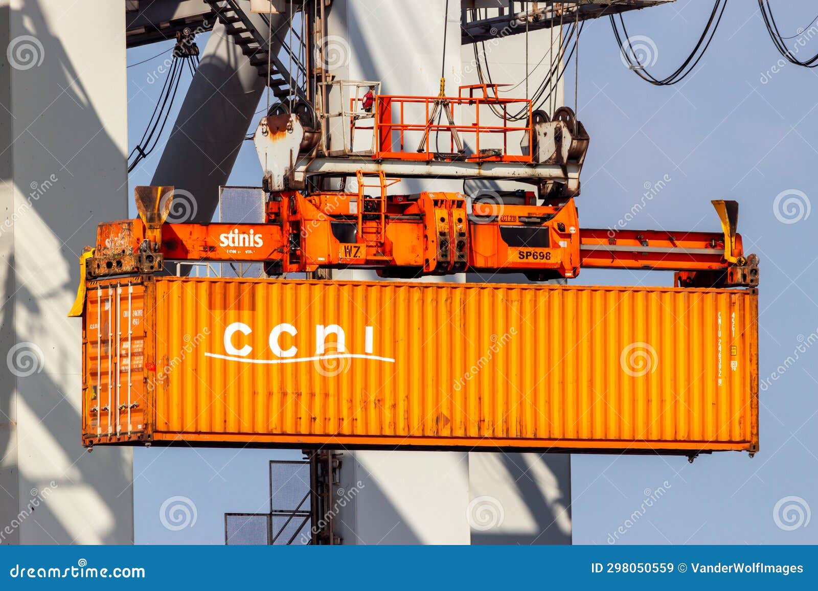 Crane Operator Unloading a Sea Container from a Cargo Ship in the Port ...