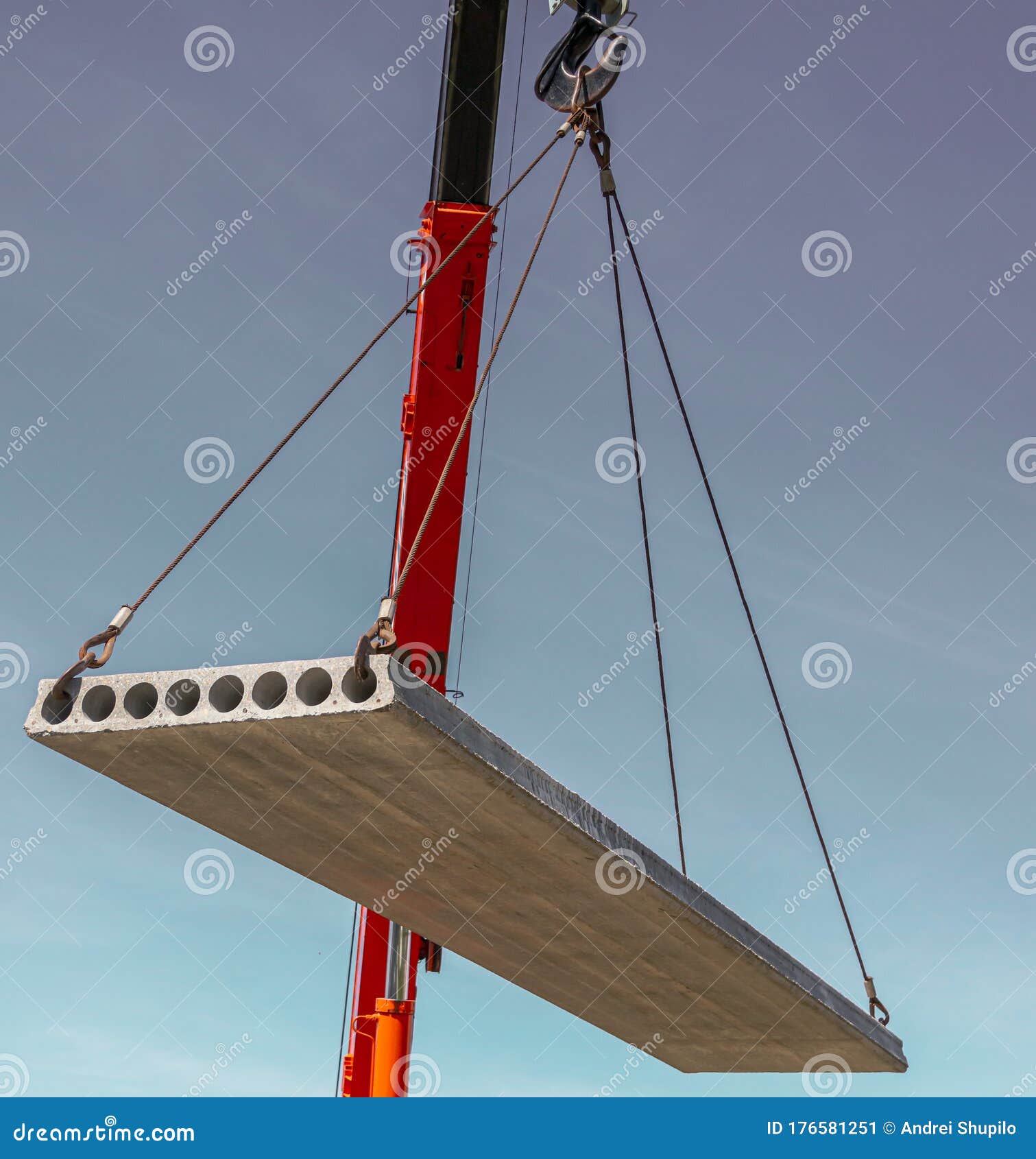 A Crane Raised a Concrete Slab at a Construction Site at Home Stock ...
