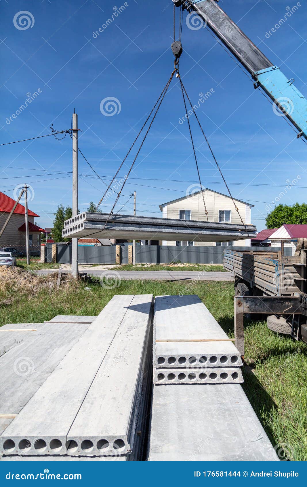 A Crane Raised a Concrete Slab at a Construction Site at Home Stock ...