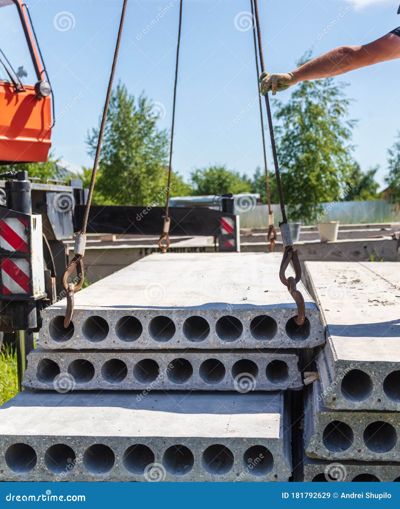A Crane Raised a Concrete Slab at a Construction Site at Home Stock ...