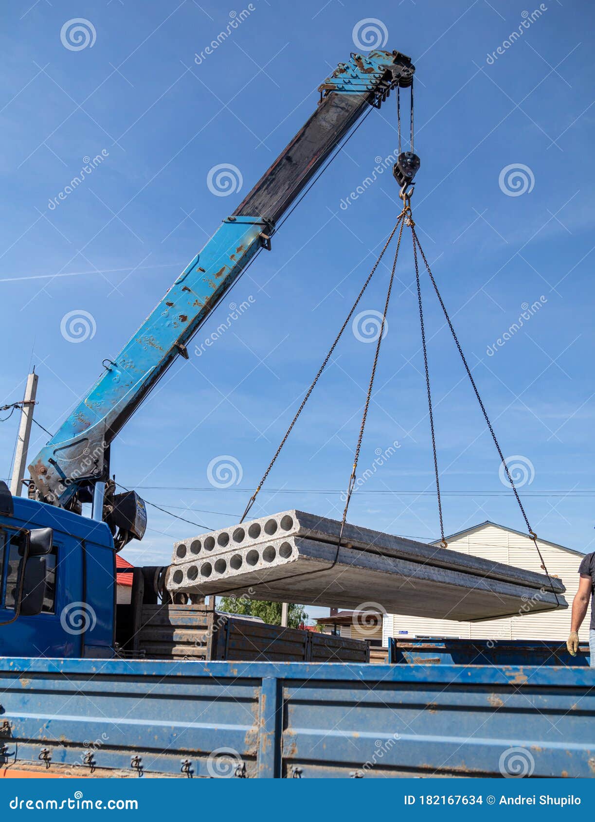 A Crane Raised a Concrete Slab at a Construction Site at Home Stock ...