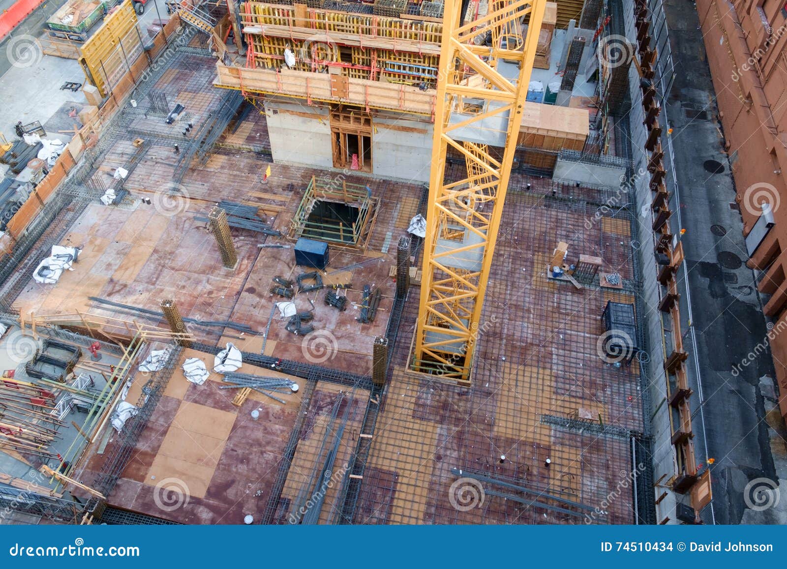 Crane Rising through Floor of Highrise Under Construction Stock Photo ...