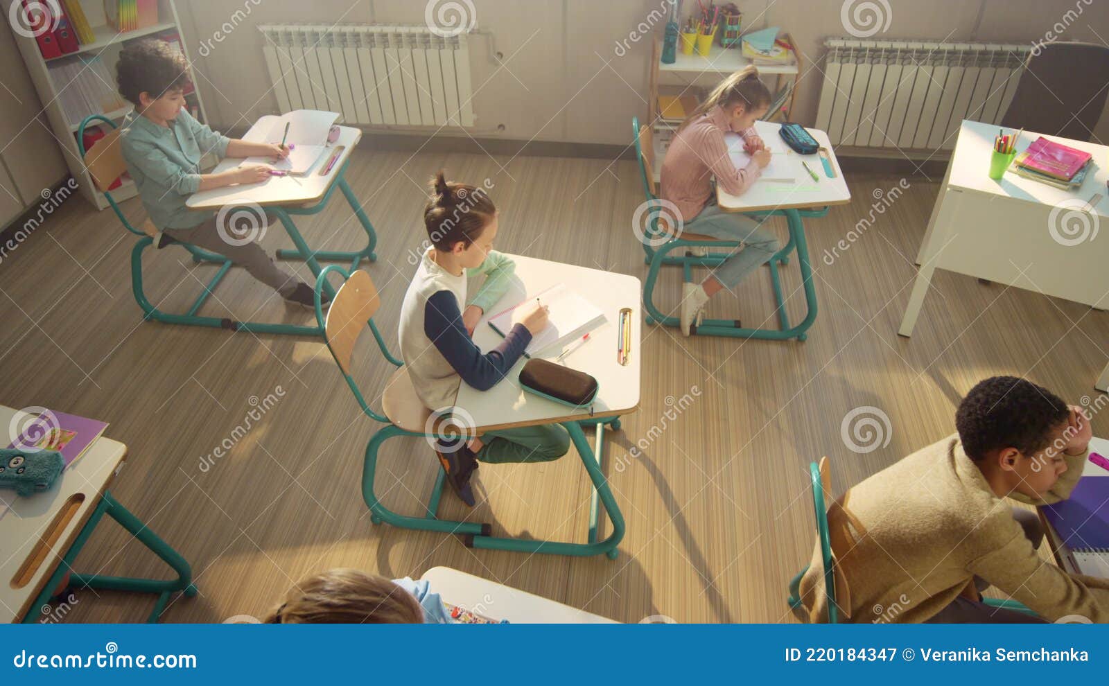 Students Doing Class Work. Schoolboys and Schoolgirls Writing in ...