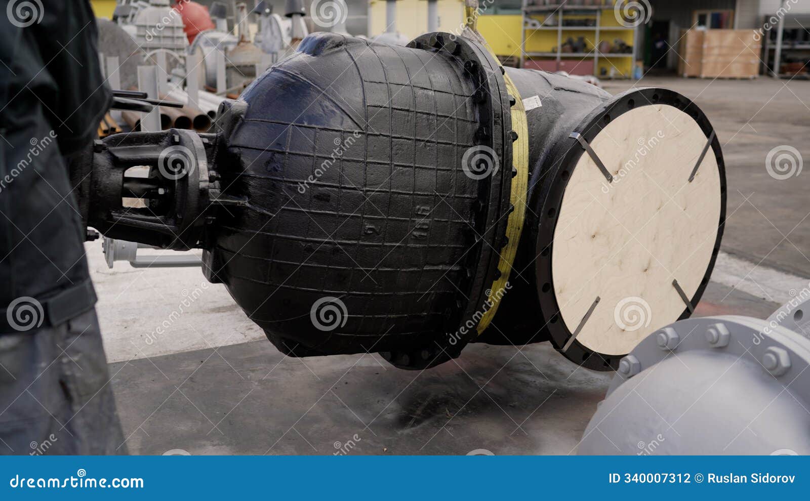 Crane Skillfully Lifting a Large Water Valve for Precise Installation ...