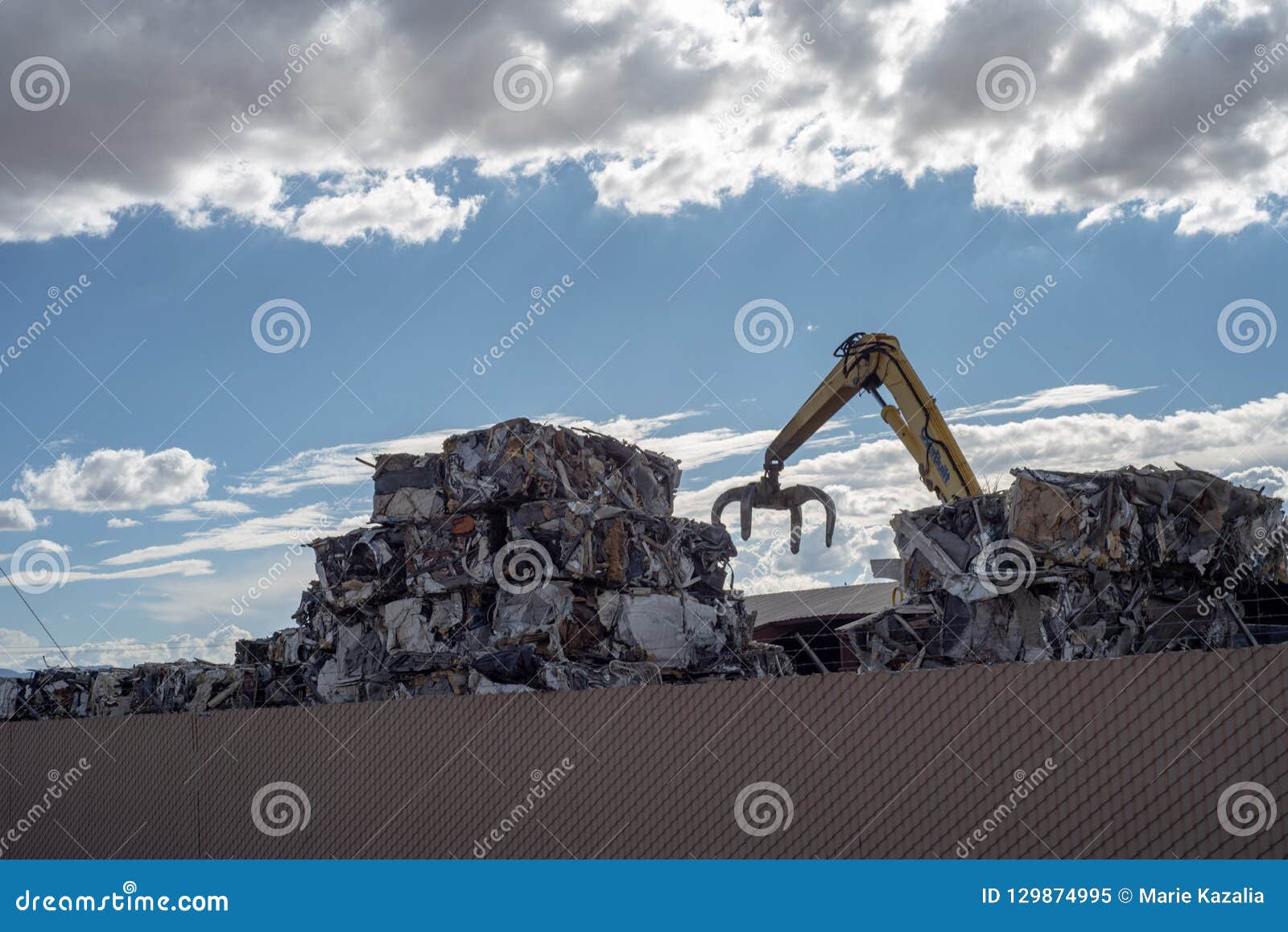 Crane Stacking Cubes Of Compressed Metal At Recycling Center Editorial ...