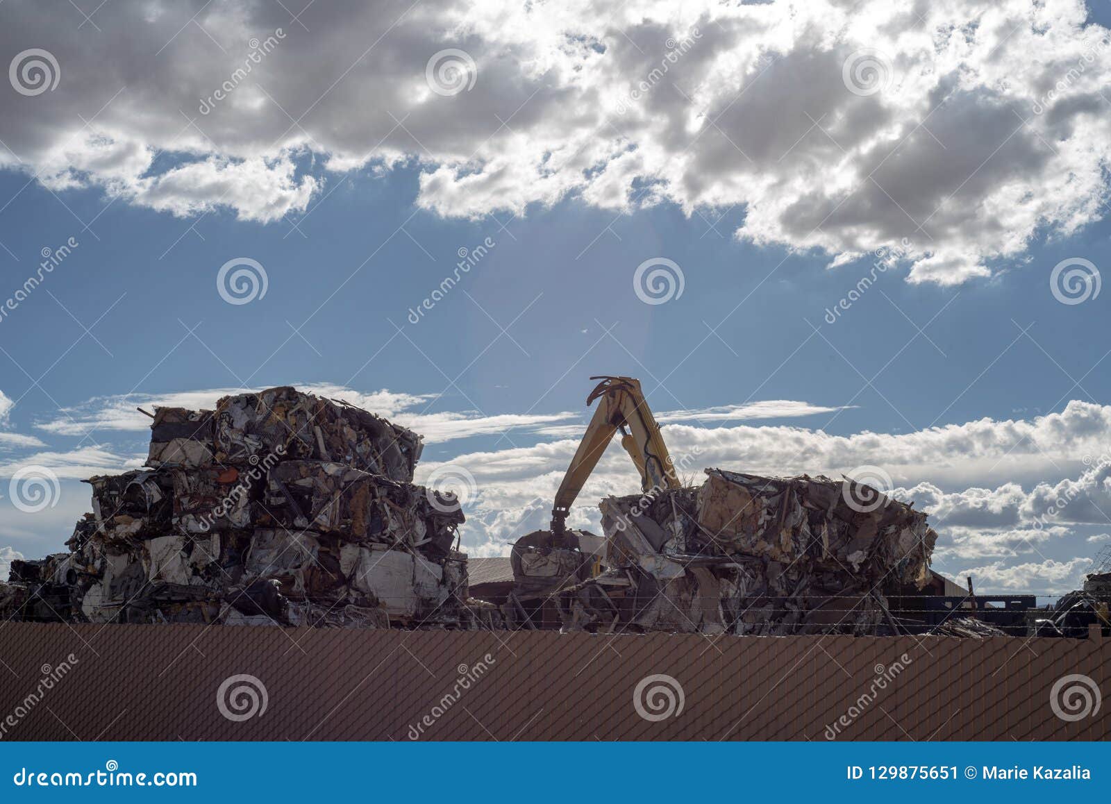Crane Stacking Cubes Of Compressed Metal At Recycling Center Editorial ...