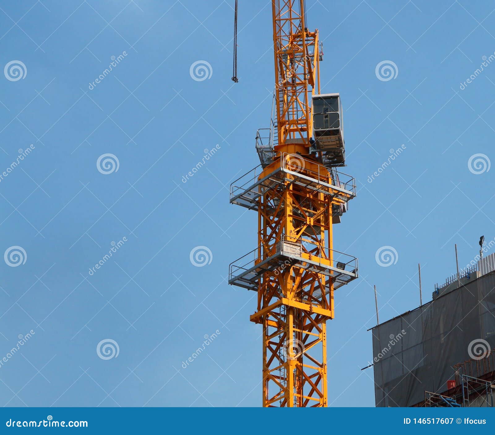 A Crane Stands Near a Building Under Construction Stock Image - Image ...