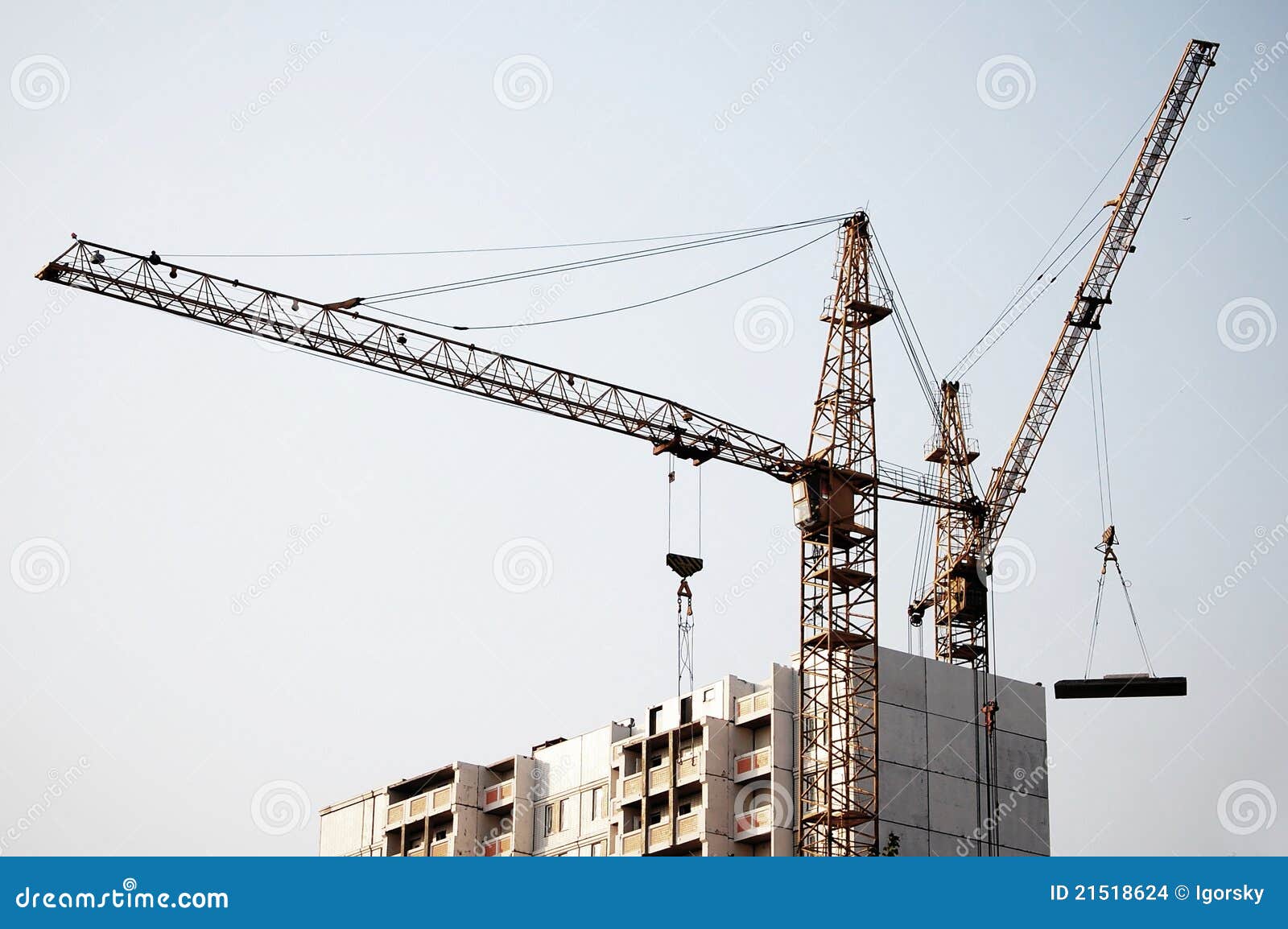 Crane on top of building stock photo. Image of heavy - 21518624