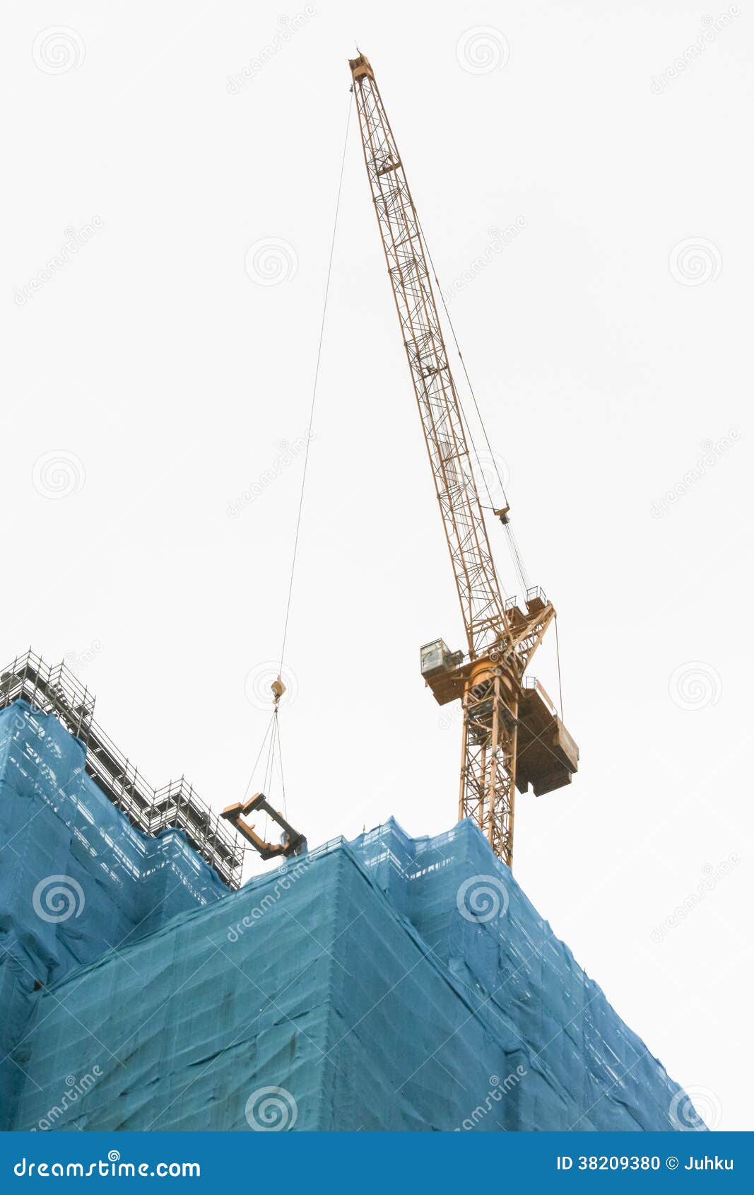 Crane on top of skyscraper stock photo. Image of build - 38209380