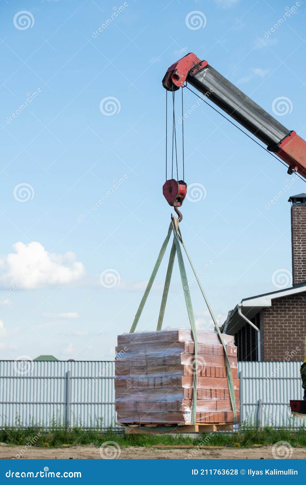 Crane Unloading the Bricks Pile Stock Photo - Image of site, brick ...