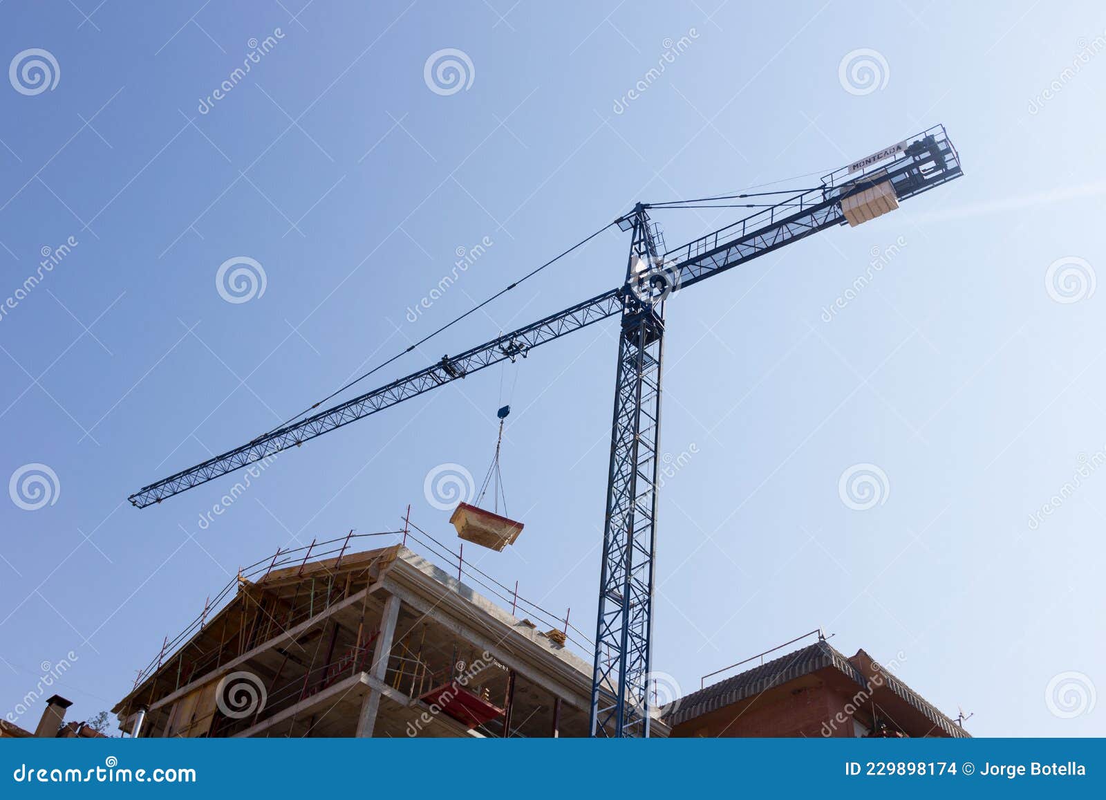Crane Working on a Construction Site Stock Photo - Image of operating ...
