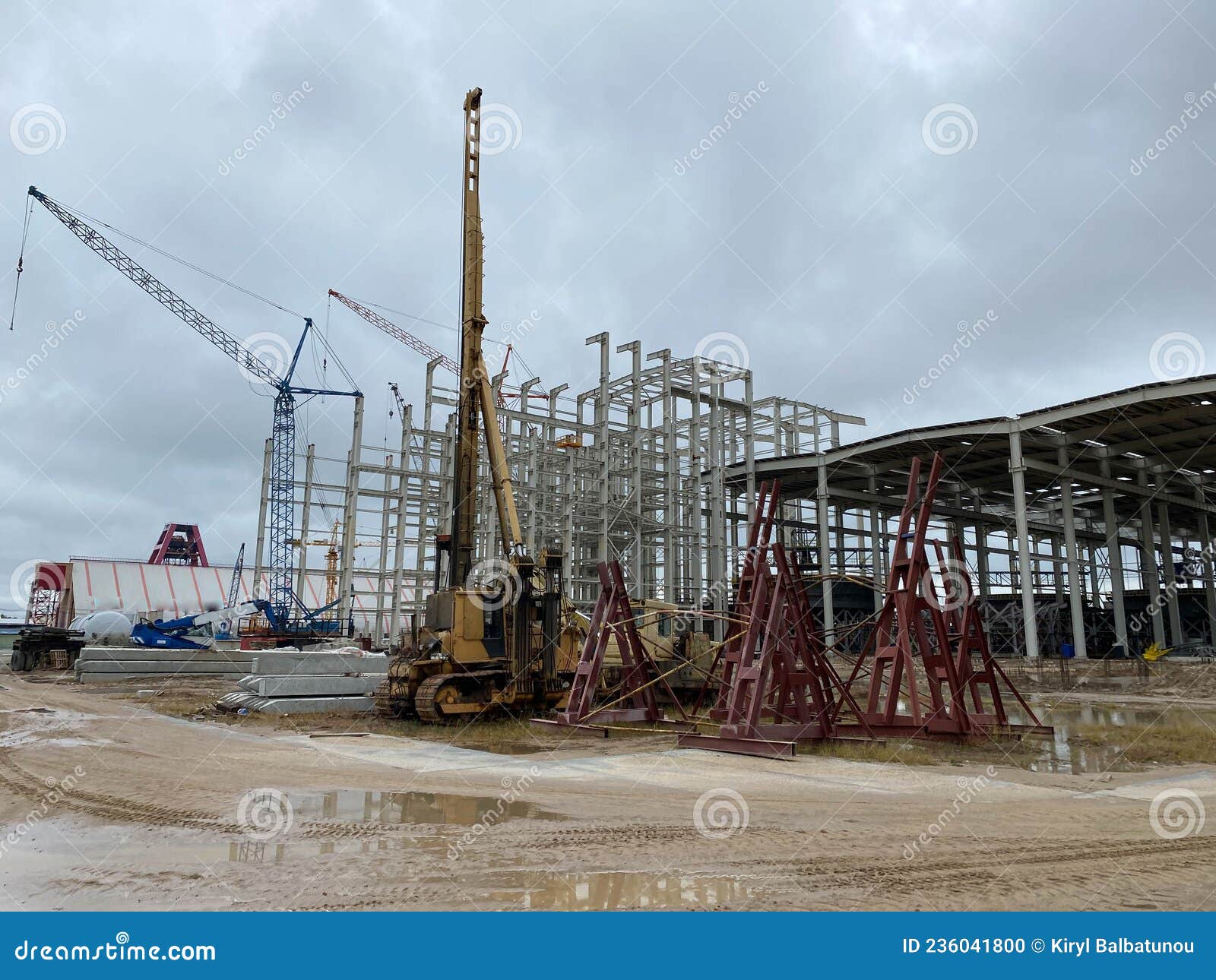 A Crane Working on a Factory Building Stock Photo - Image of ...