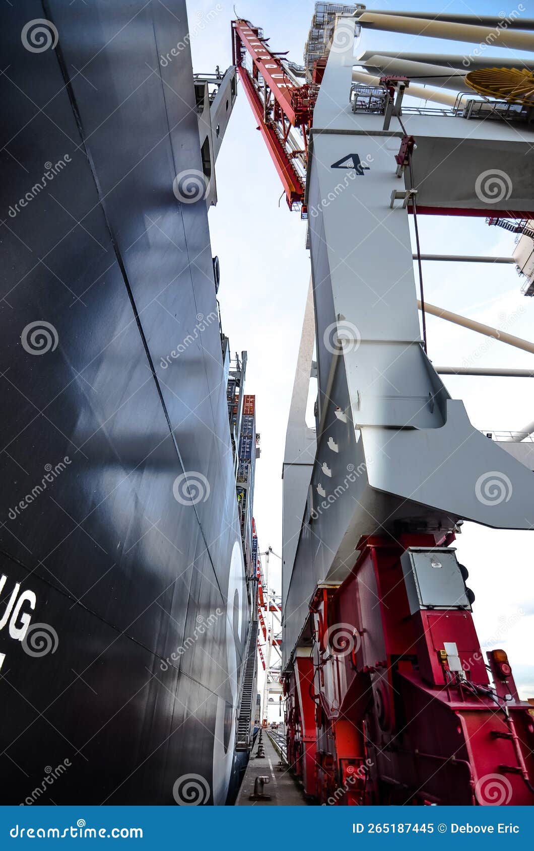 Cranes for Handling Containers on the Docks Next To a Container Ship ...