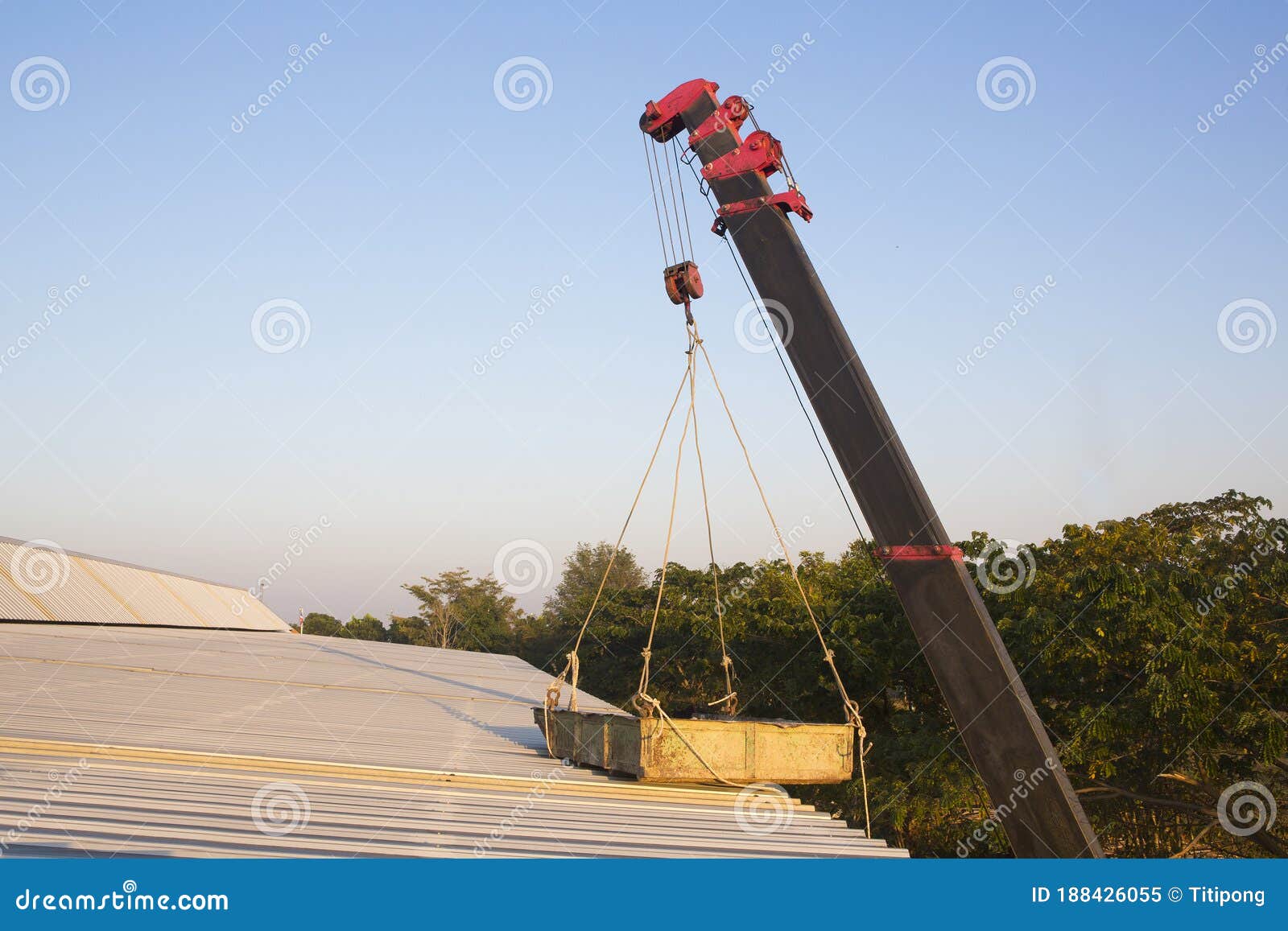 Cranes lift on the roof stock image. Image of cutting - 188426055