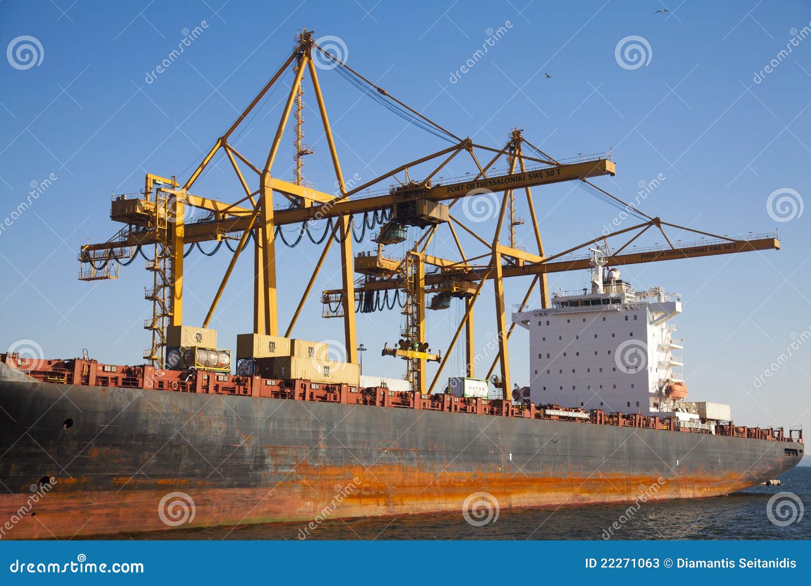 Cranes load containers editorial stock photo. Image of industry - 22271063