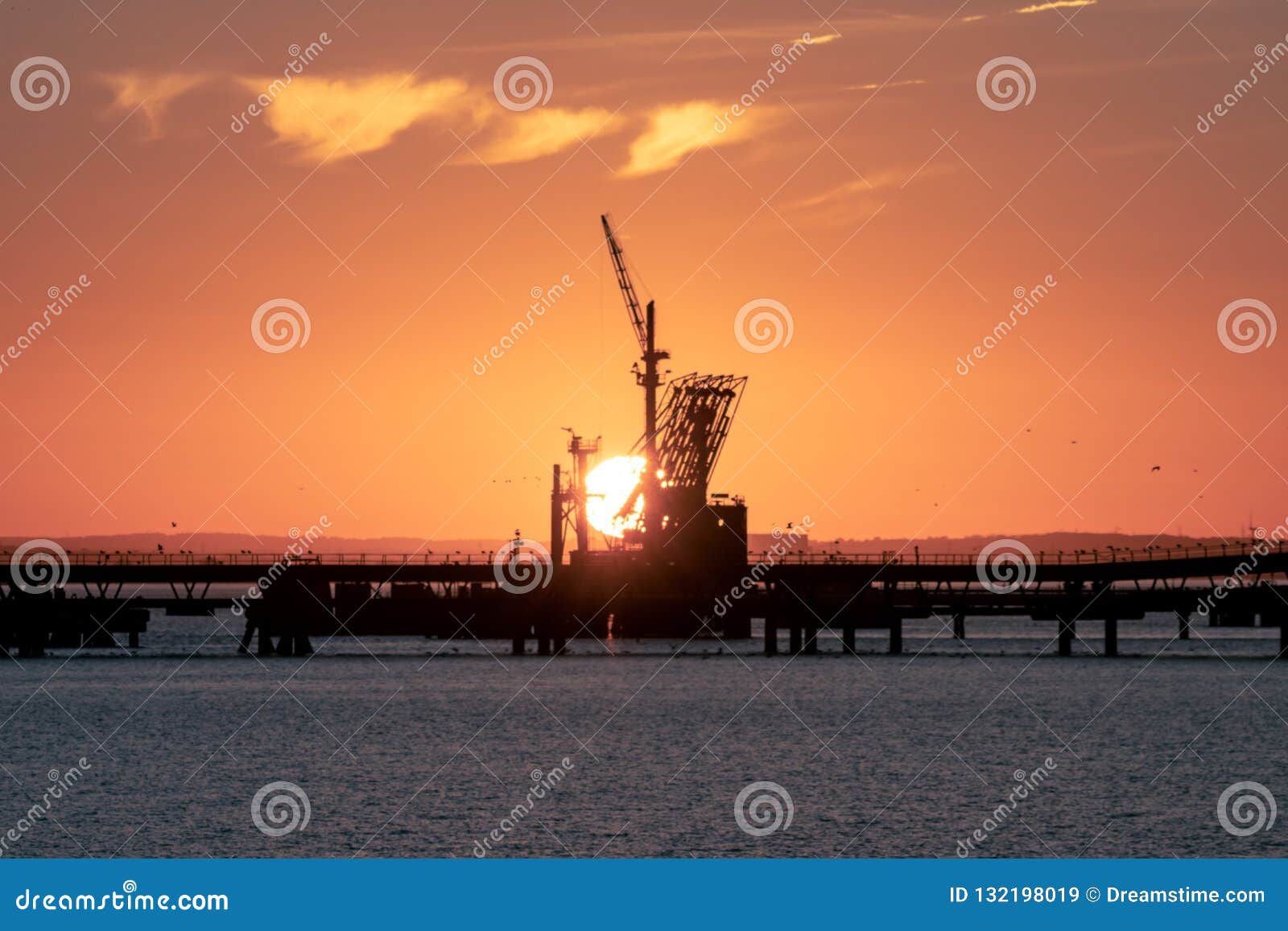Cranes at sunset stock image. Image of shipyard, canvey - 132198019