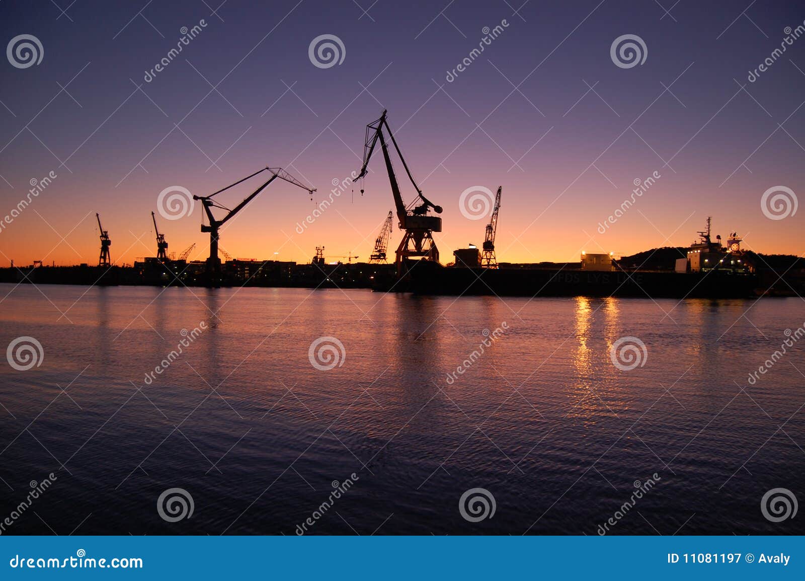 Cranes at Sunset Near Harbour Stock Image - Image of orange, hills ...