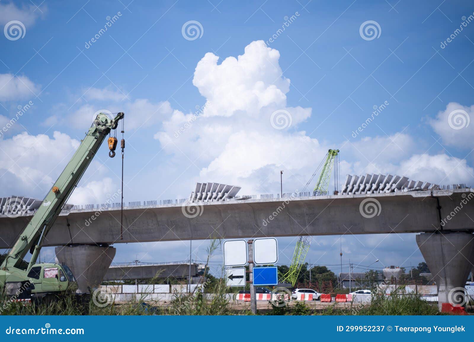 Cranes and Tower Cranes at the Construction Site of an Elevated Road ...