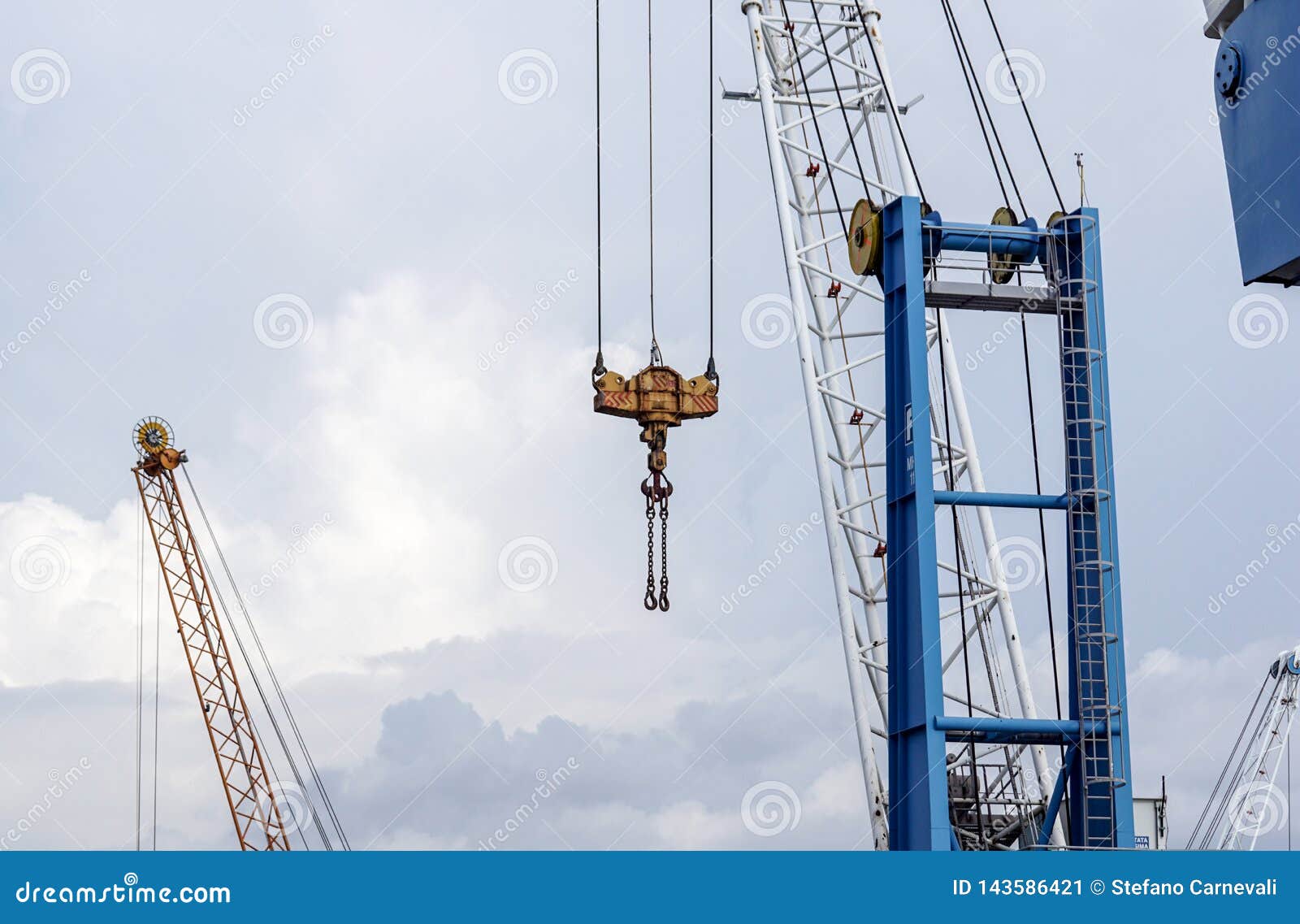 Cranes Unloading a Ship in a Harbor . Industrial Crane Stock Image ...