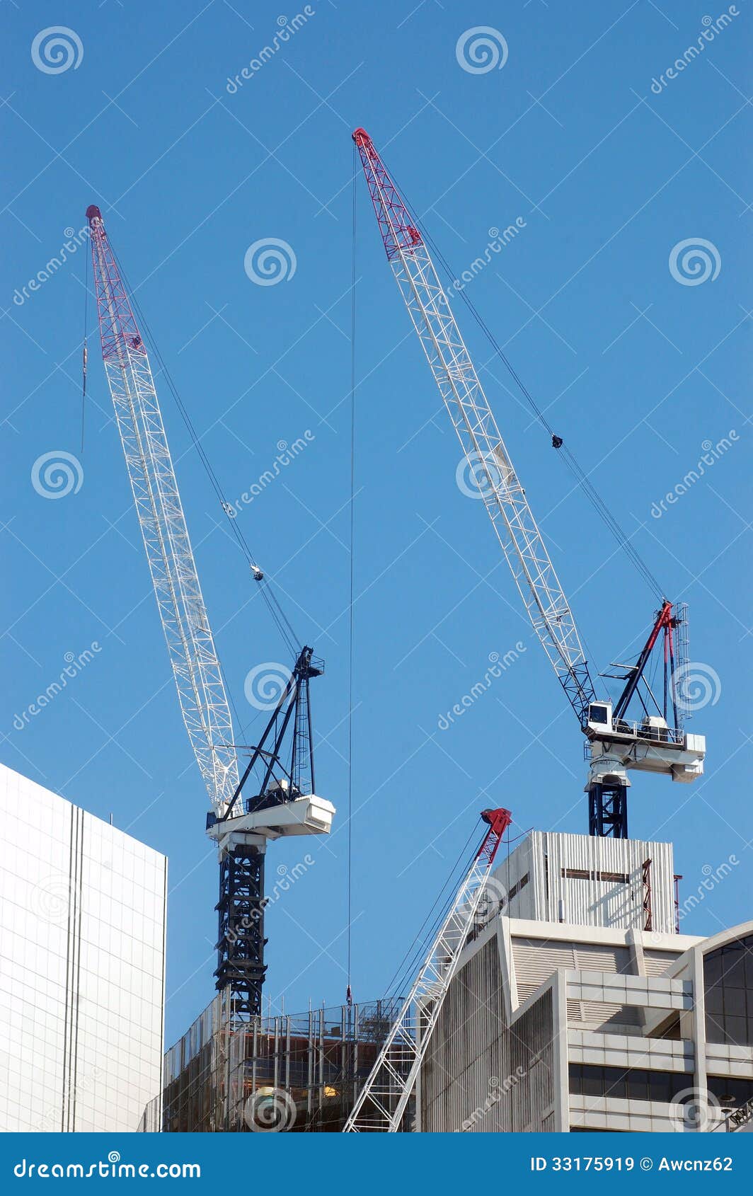 Cranes at work stock image. Image of city, urban, lifting - 33175919