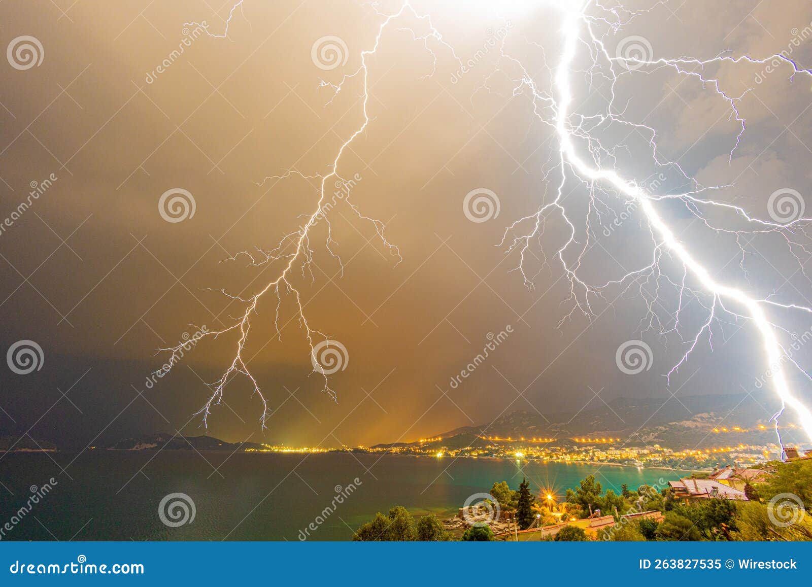 Crash of Thunder and Lightning Over the City among the Clouds through ...