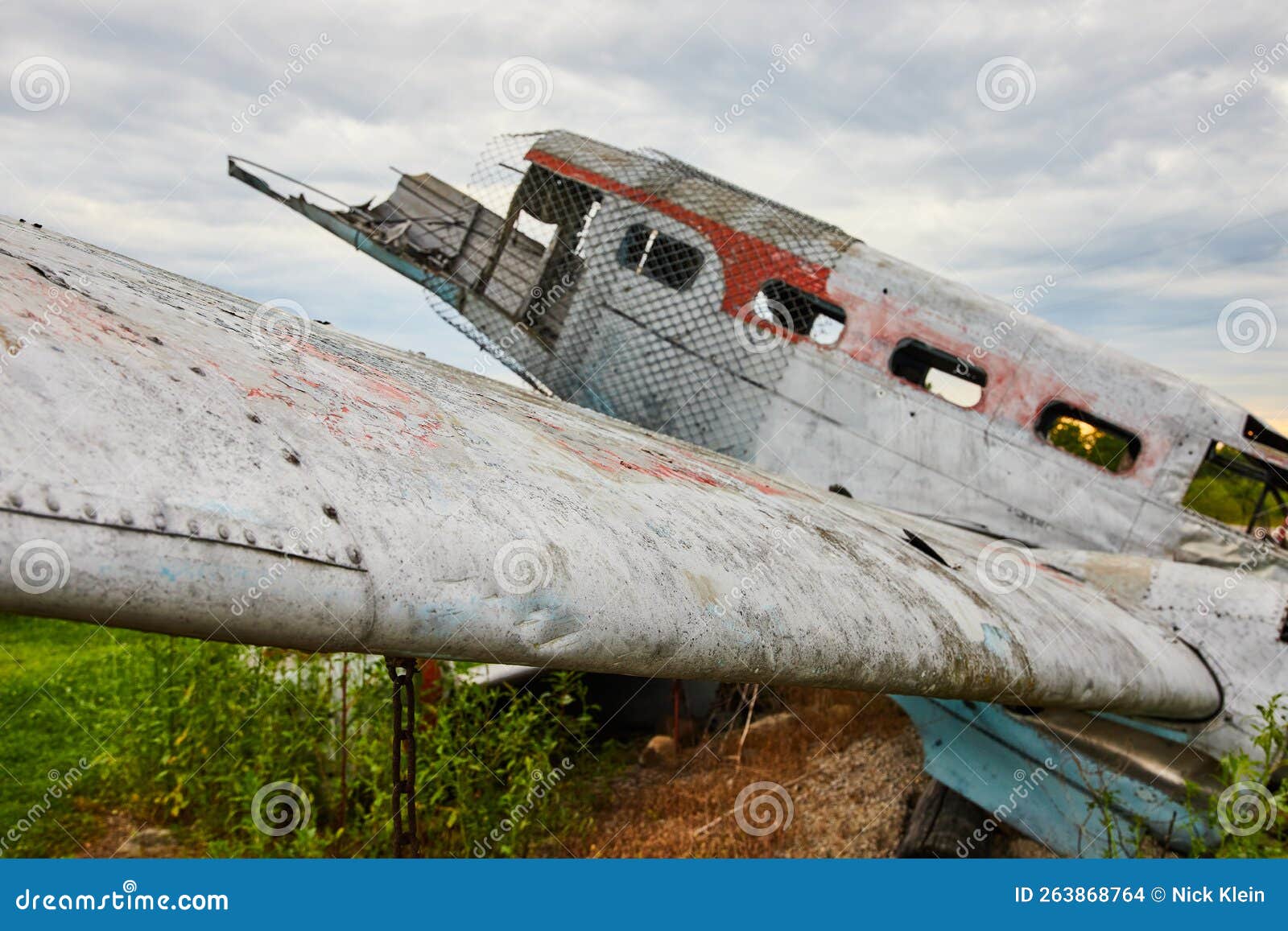 Crashed and Abandoned Airplane Wing Detail in Fields on Cloudy Day ...