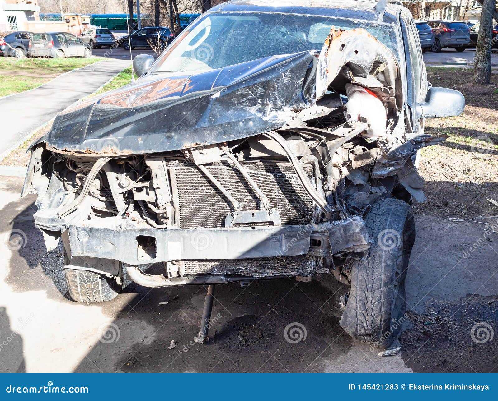 Crashed car on city street stock image. Image of wheel - 145421283