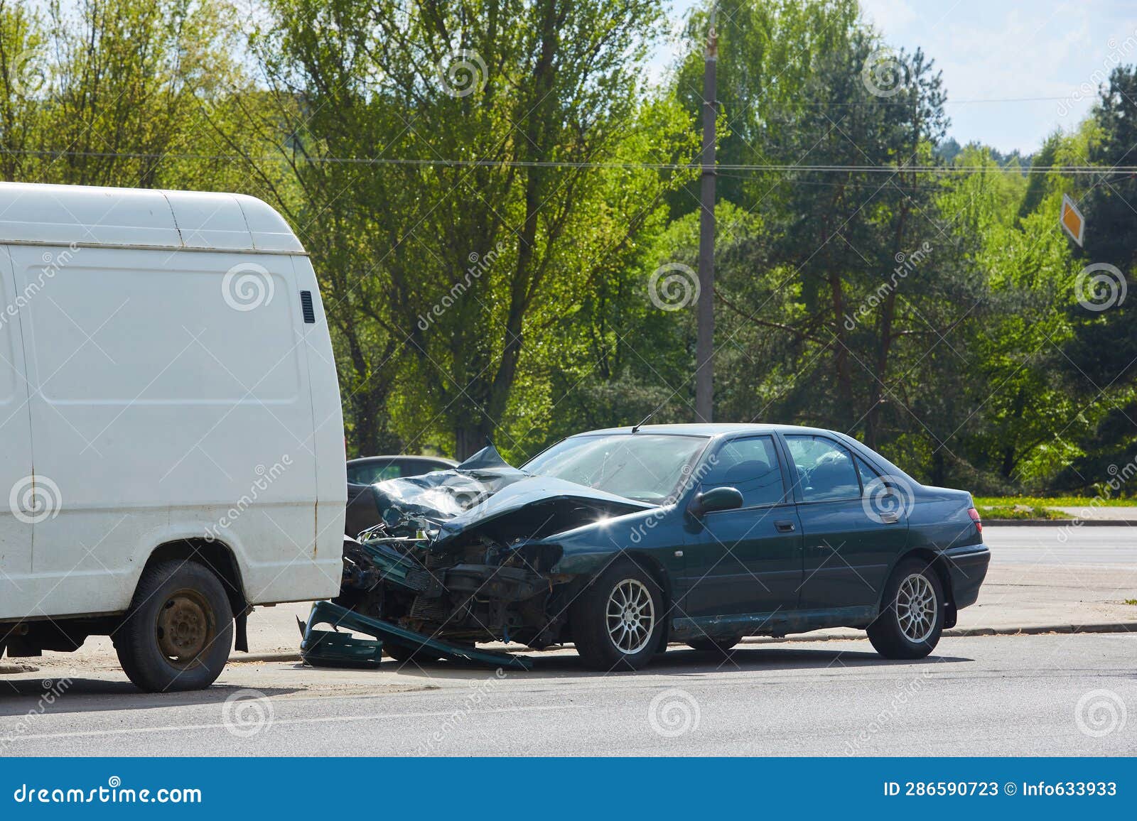 Crashed Car in Collision on Roadway. Car Accident with Major Front End ...
